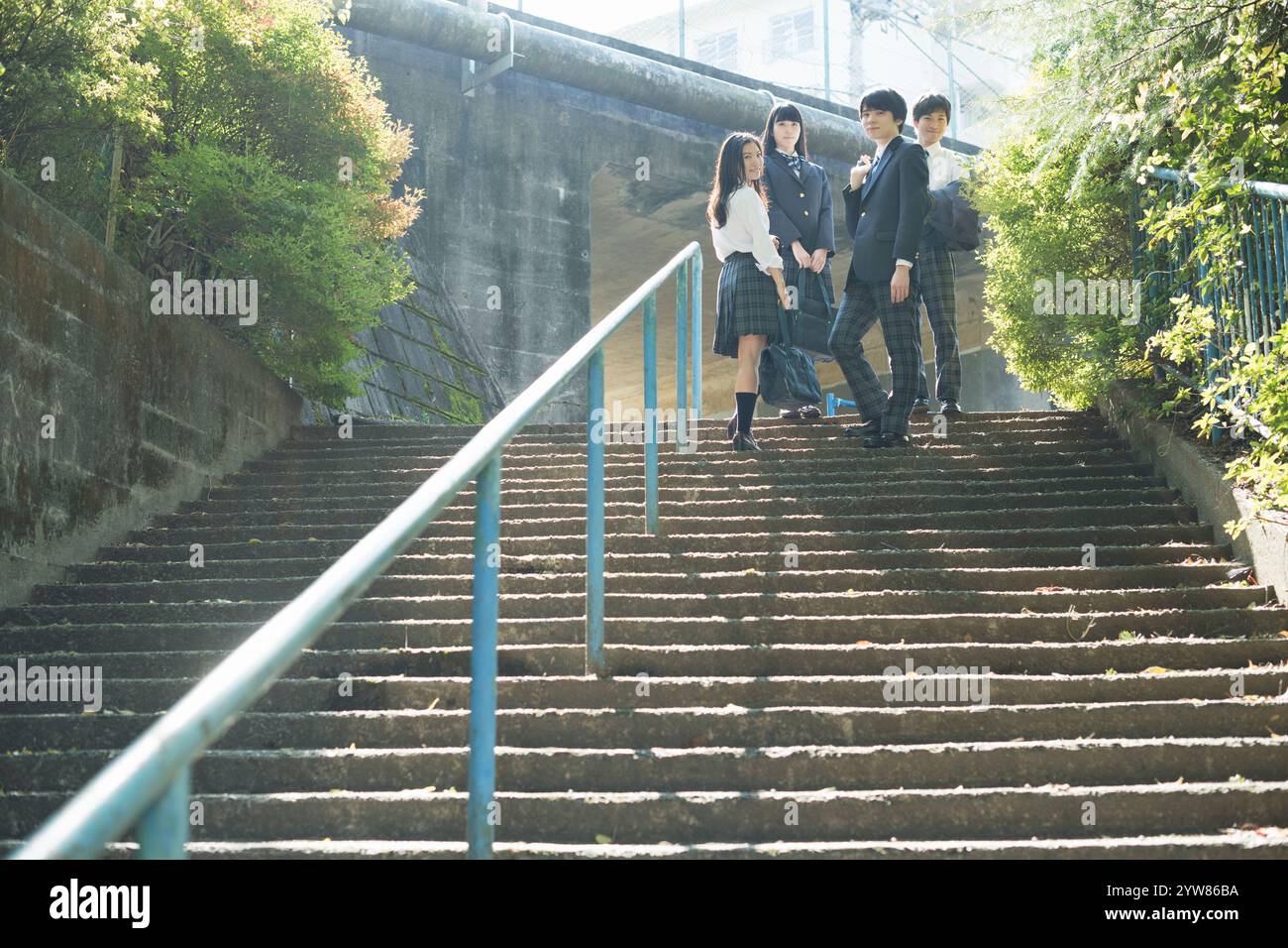 Portrait of high school students on their way to school Stock Photo - Alamy