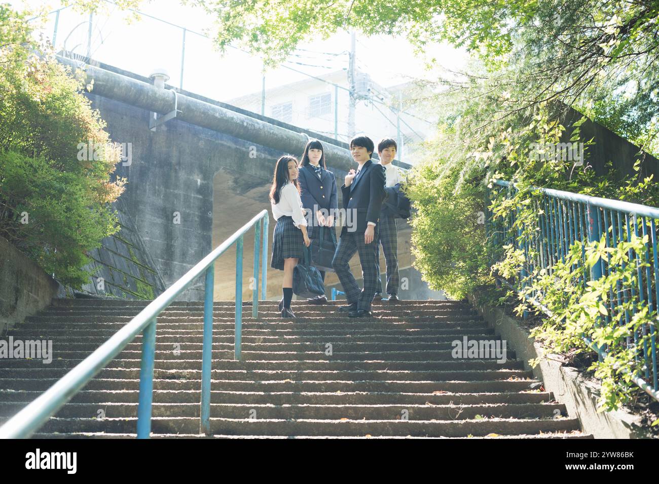 Portrait of high school students on their way to school Stock Photo - Alamy