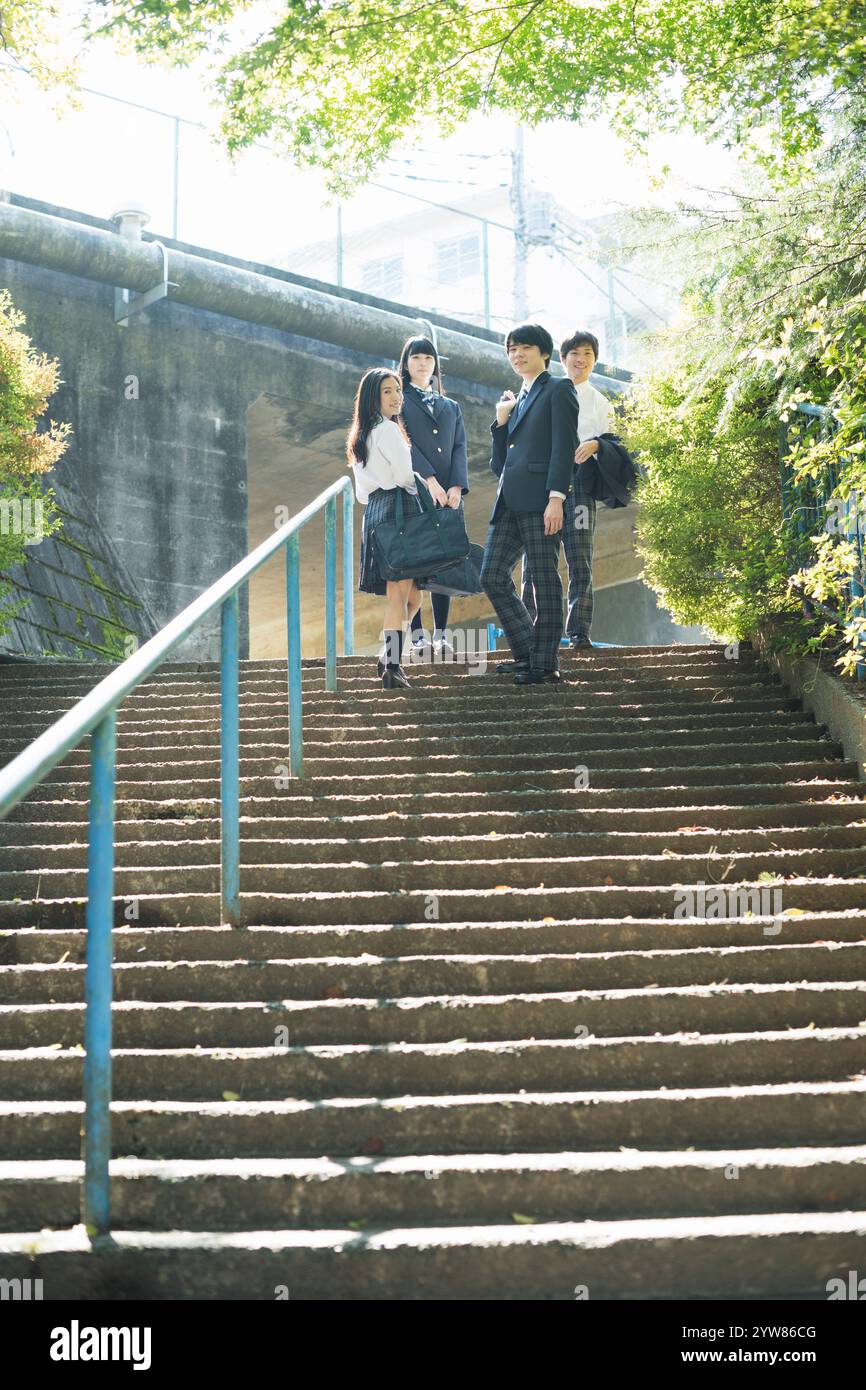 Portrait of high school students on their way to school Stock Photo - Alamy