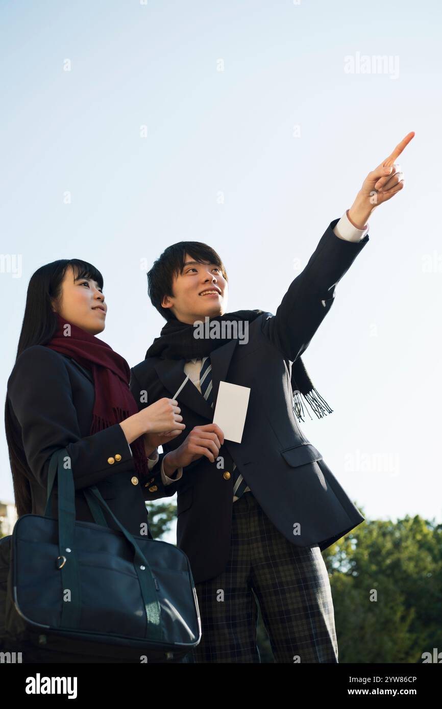 Two young successful happy students hi-res stock photography and images ...