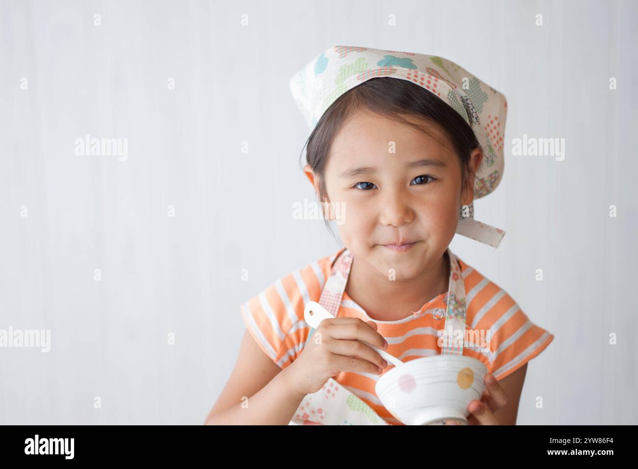 Child eating rice hi-res stock photography and images - Alamy
