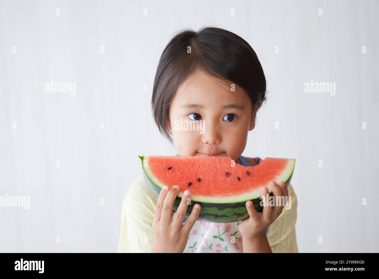 Girl eating watermelon Stock Photo - Alamy