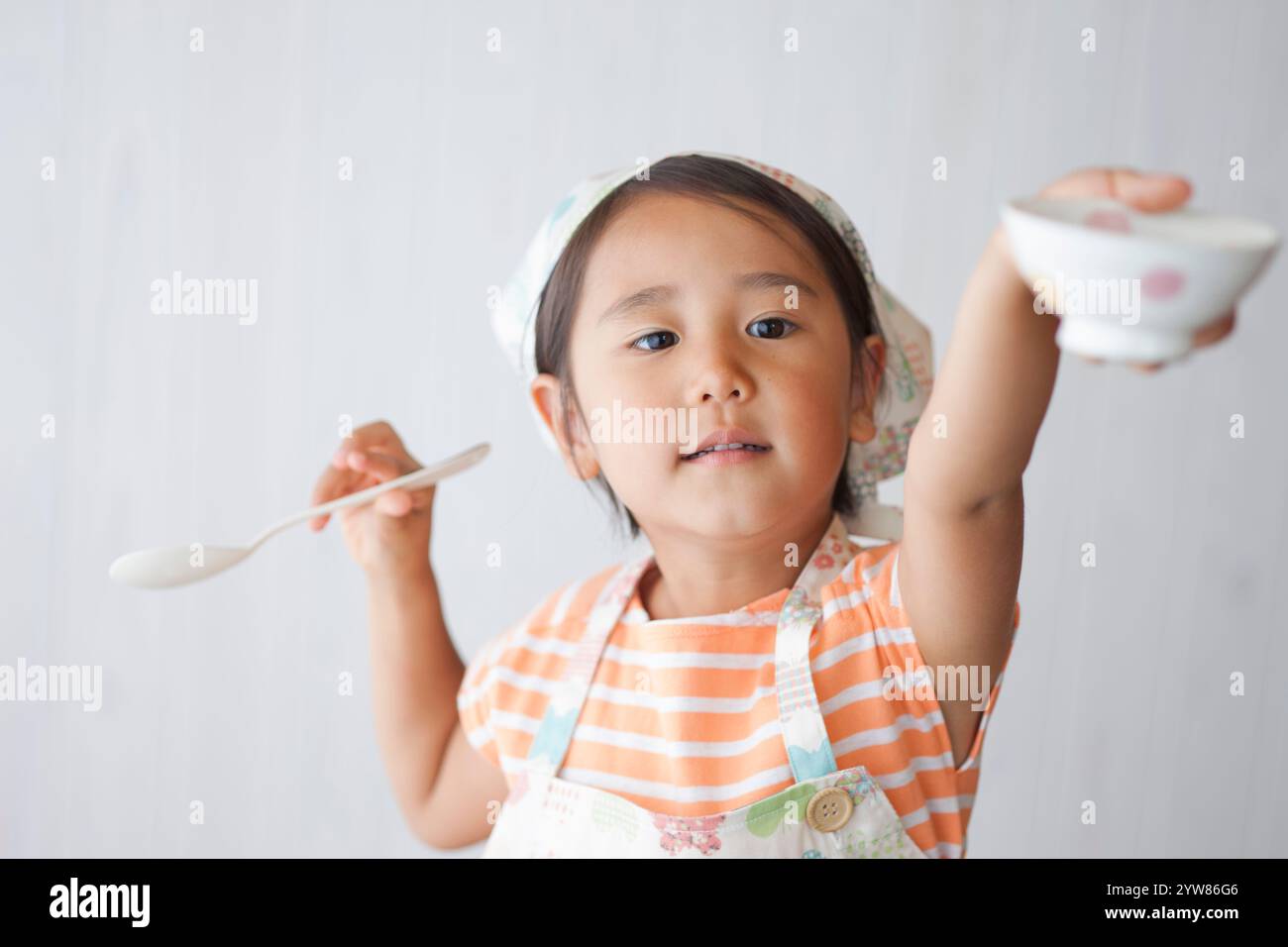 Child eating rice hi-res stock photography and images - Alamy