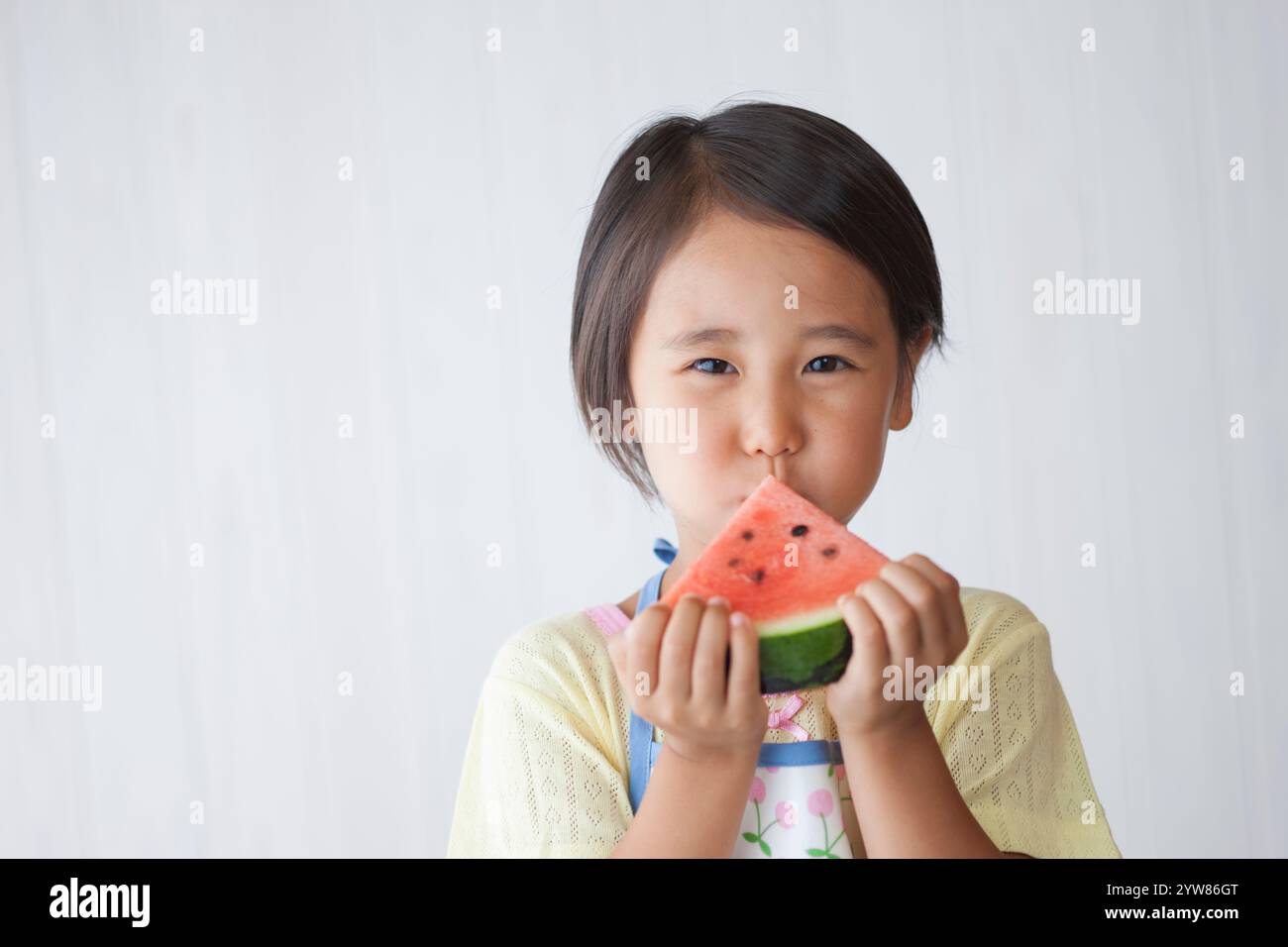 Girl eating watermelon Stock Photo - Alamy