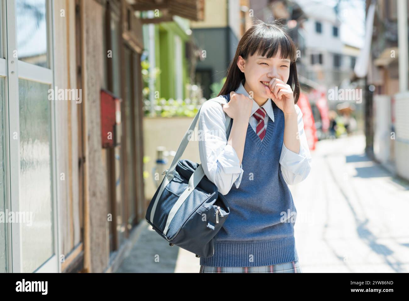 Female high school students arriving at and leaving school Portrait ...