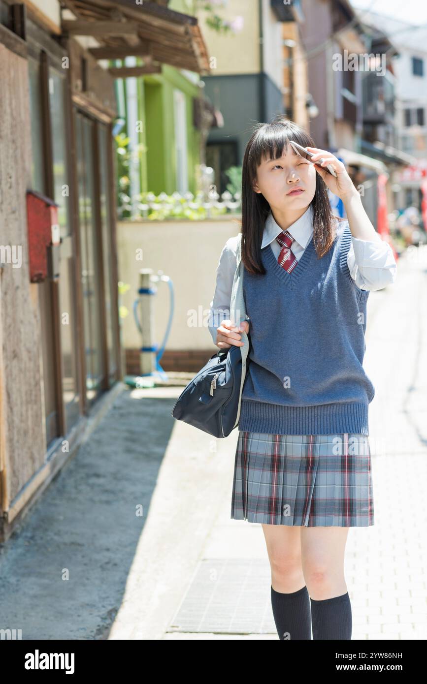 Female high school students arriving at and leaving school Portrait ...
