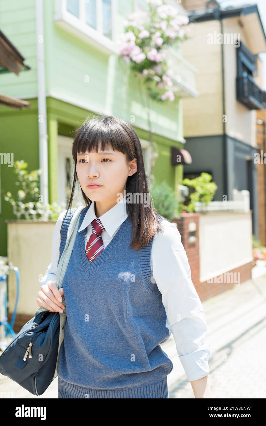 Female high school students arriving at and leaving school Portrait ...
