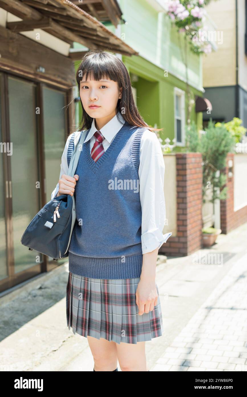 Female high school students arriving at and leaving school Portrait ...
