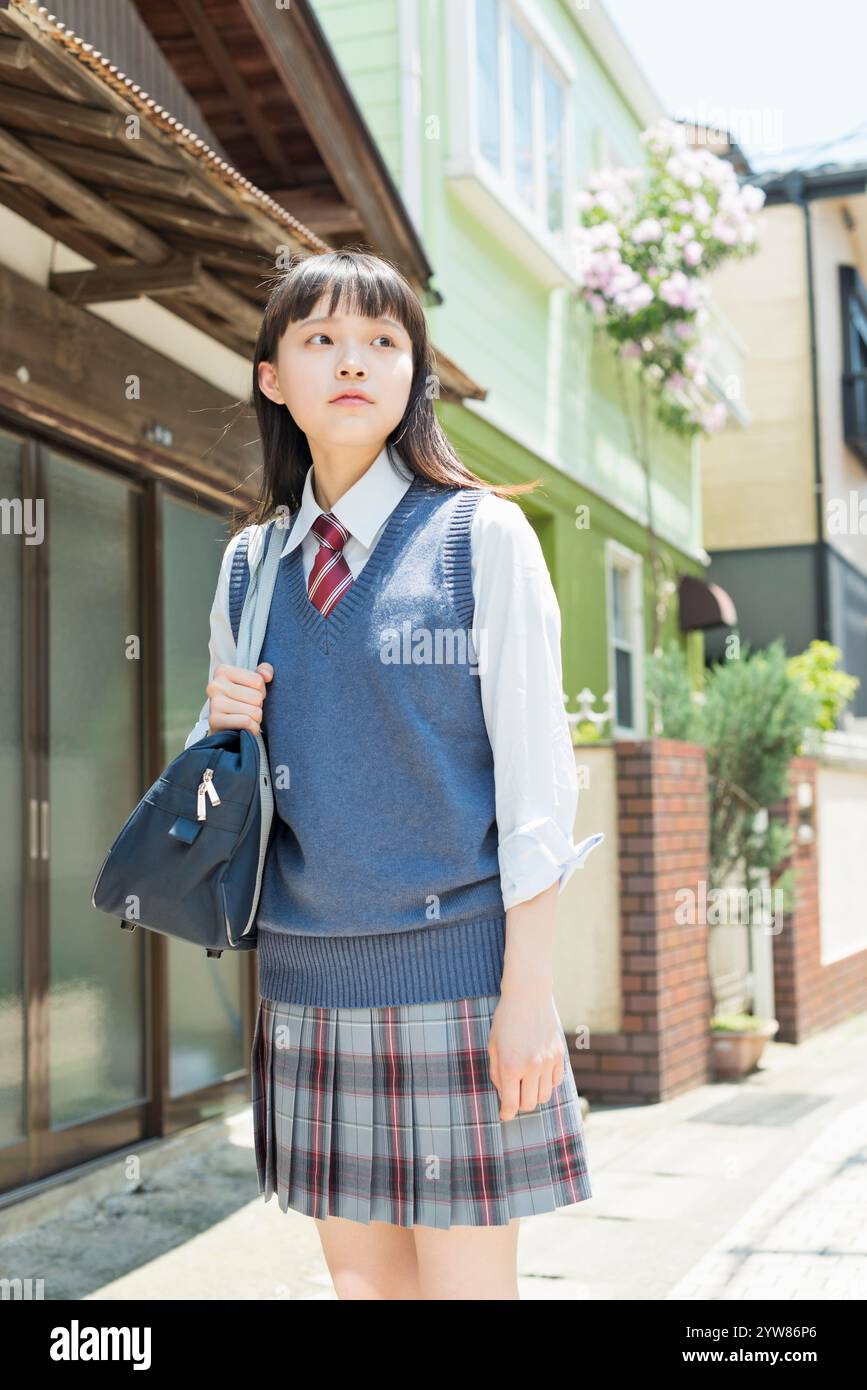 Female high school students arriving at and leaving school Portrait ...