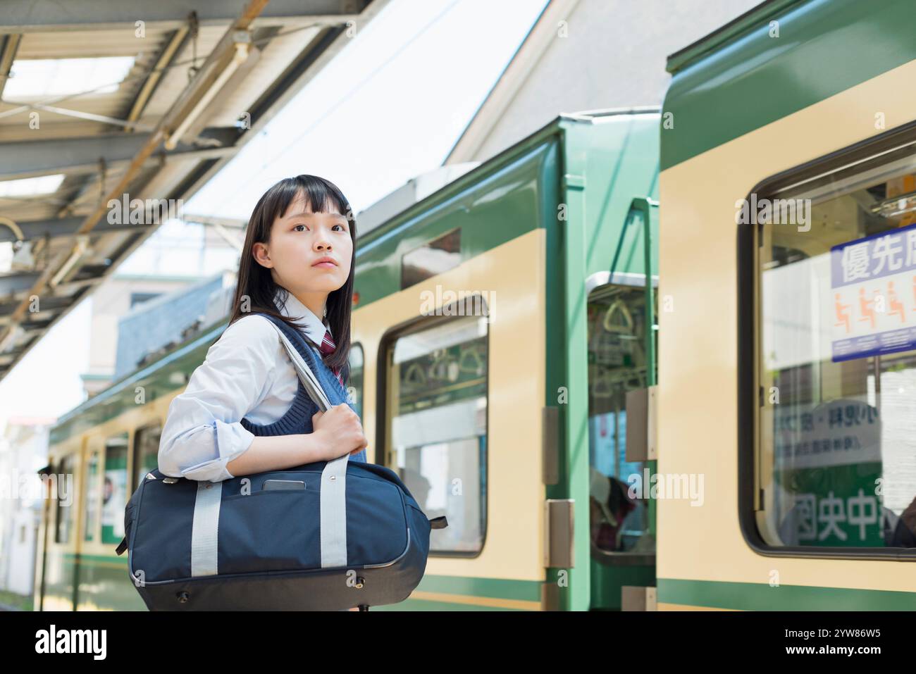 High school girls Going to school by train Stock Photo - Alamy