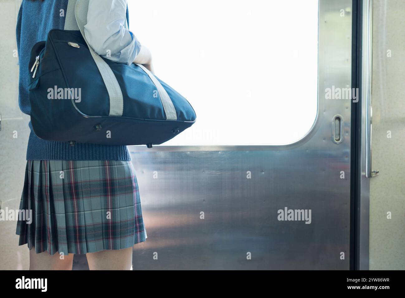High school girls Going to school by train Stock Photo - Alamy