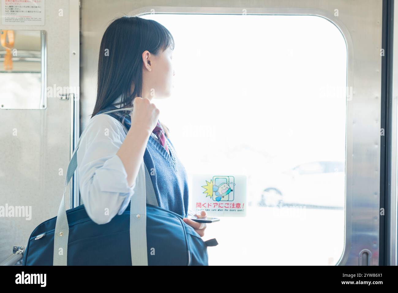 High school girls Going to school by train Stock Photo - Alamy