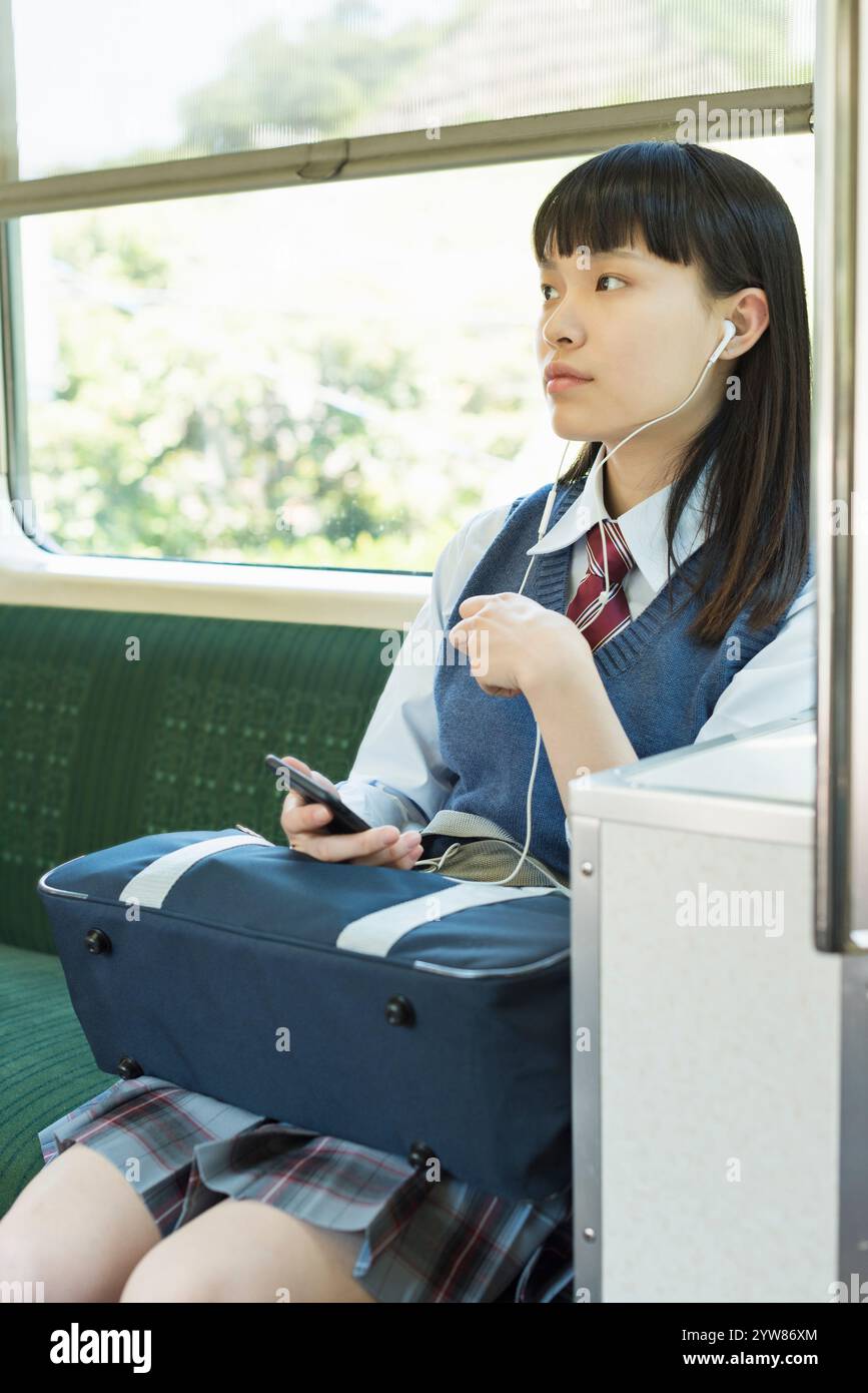 High school girls Going to school by train Stock Photo - Alamy