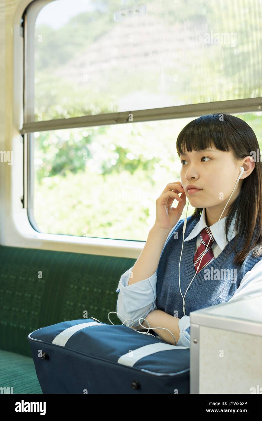 High school girls Going to school by train Stock Photo - Alamy