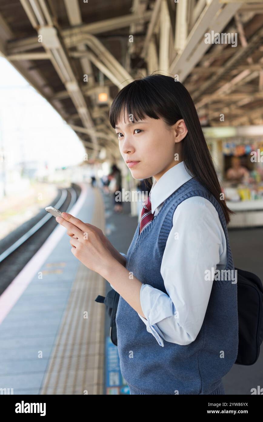 High school girls Going to school by train Stock Photo - Alamy