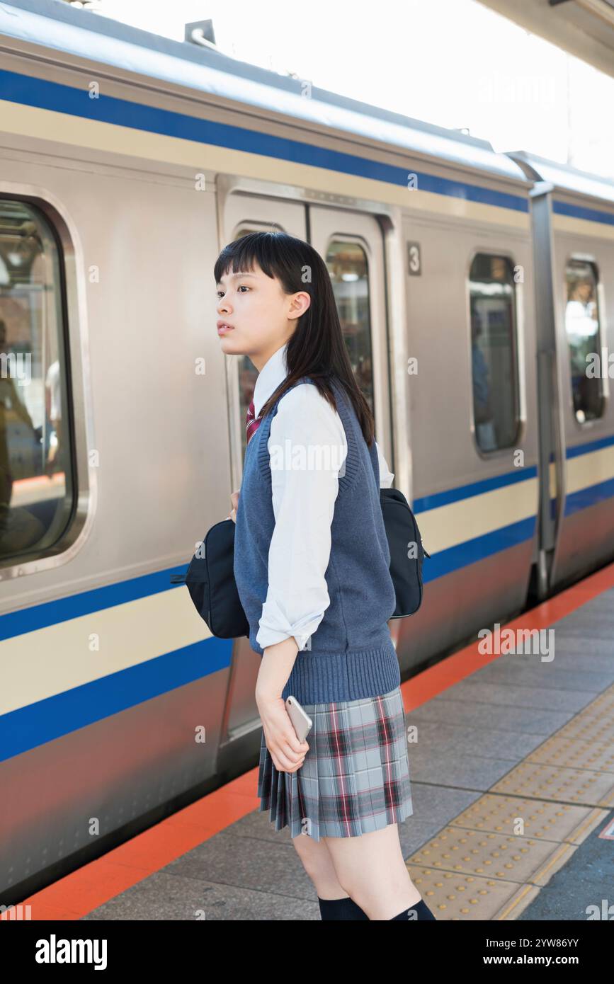 High school girls Going to school by train Stock Photo - Alamy