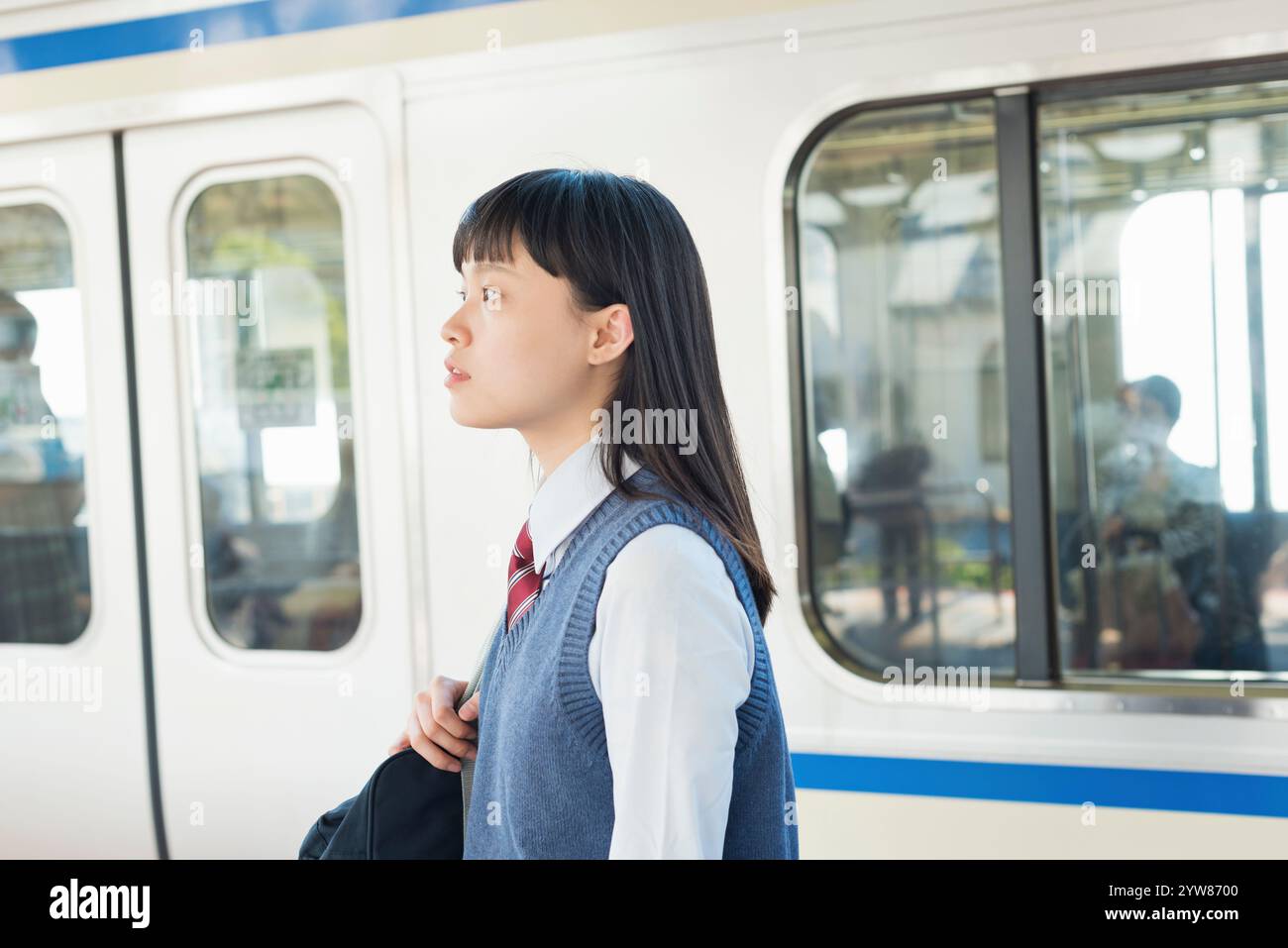 High school girls Going to school by train Stock Photo - Alamy