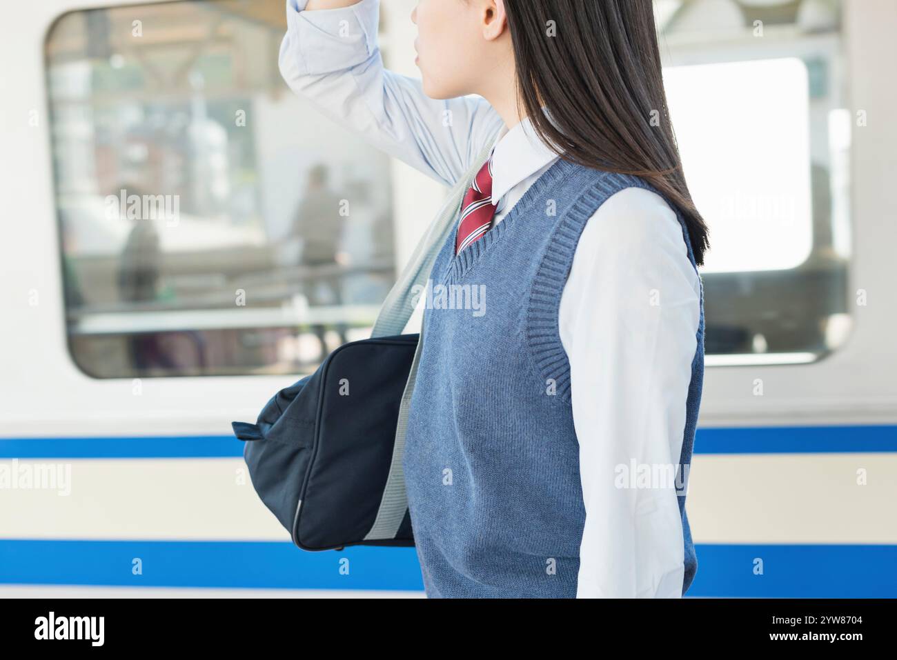 High school girls Going to school by train Stock Photo - Alamy