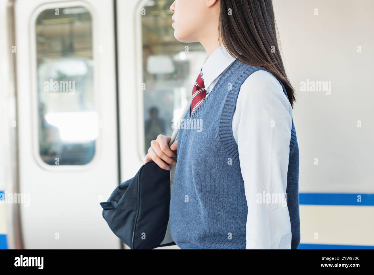 High school girls Going to school by train Stock Photo - Alamy