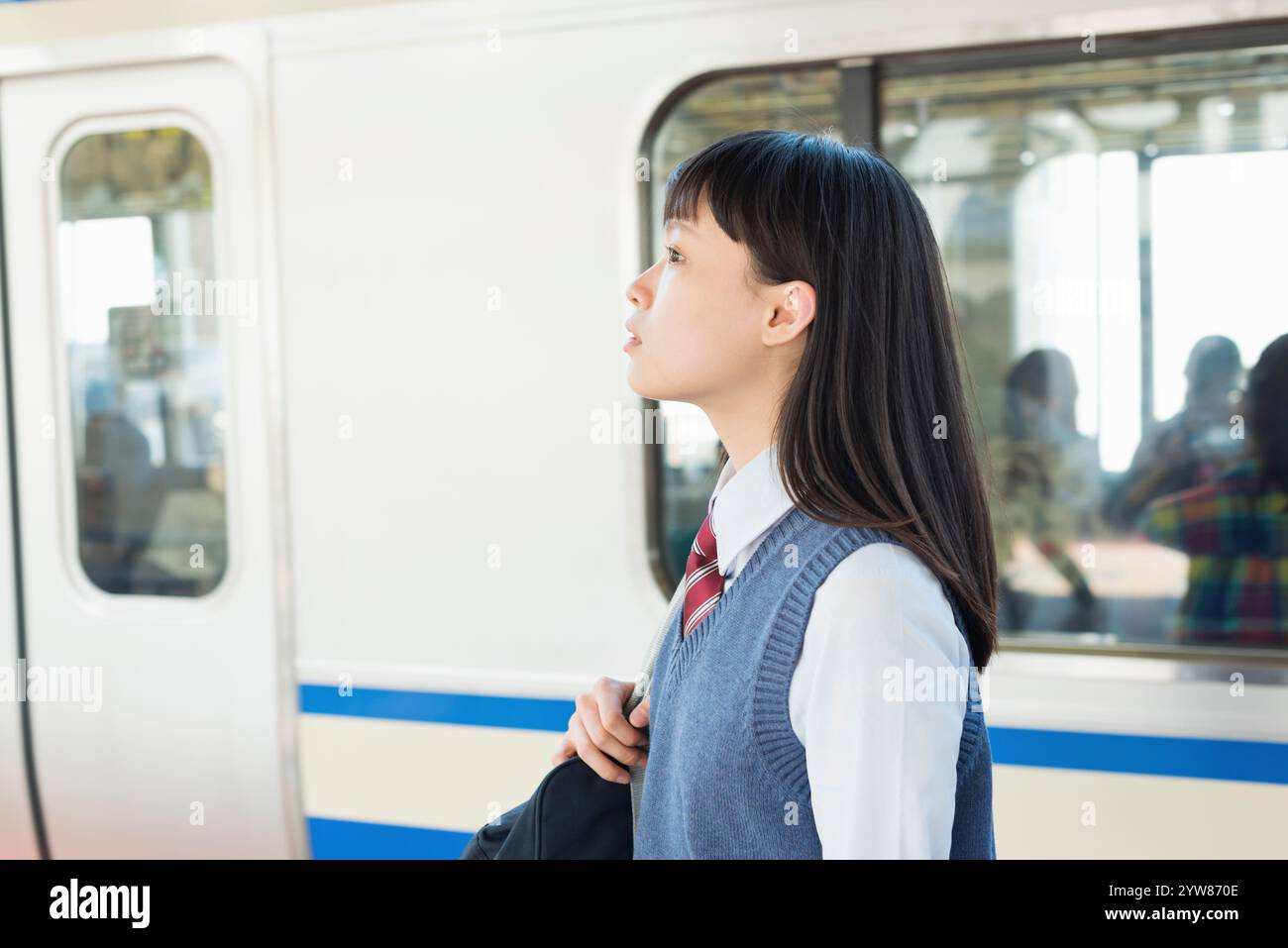 High school girls Going to school by train Stock Photo - Alamy