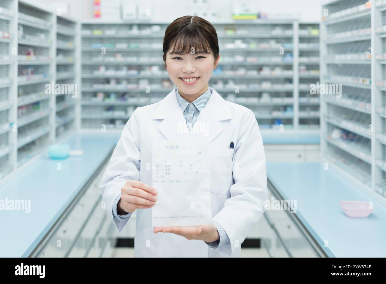 Young pharmacy staff hi-res stock photography and images - Alamy