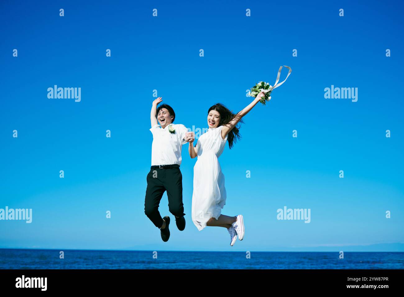 Wedding Jumping Blue sky Stock Photo - Alamy