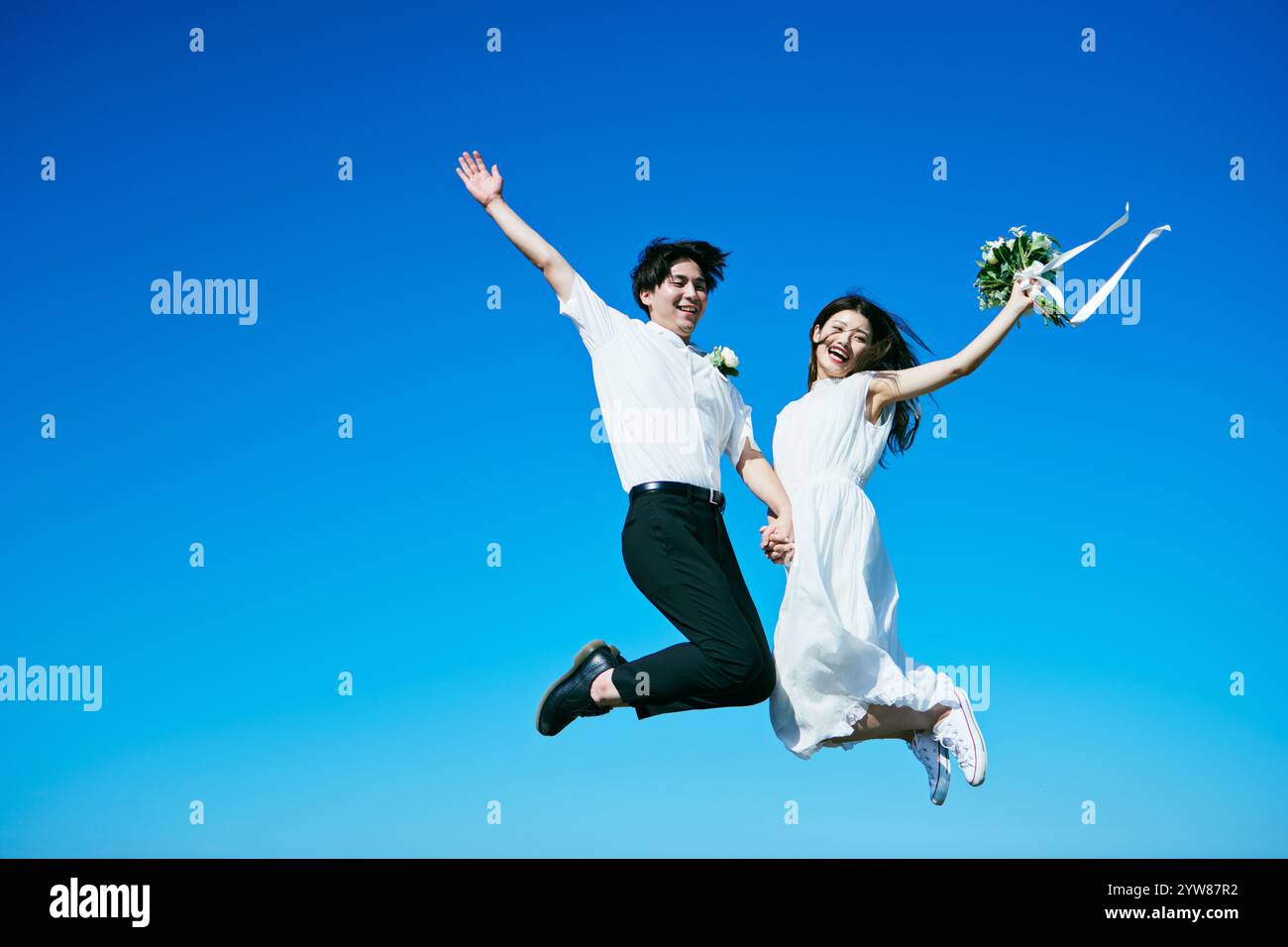 Wedding Jumping Blue sky Stock Photo - Alamy
