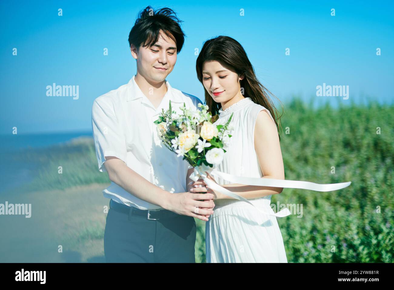 Wedding Couple Blue Sky Stock Photo - Alamy