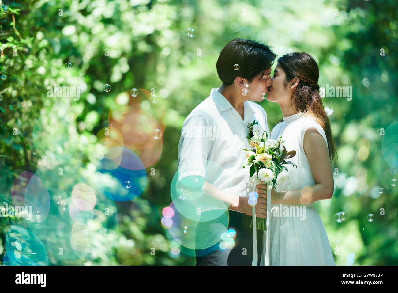 Wedding Couple Kissing Stock Photo - Alamy
