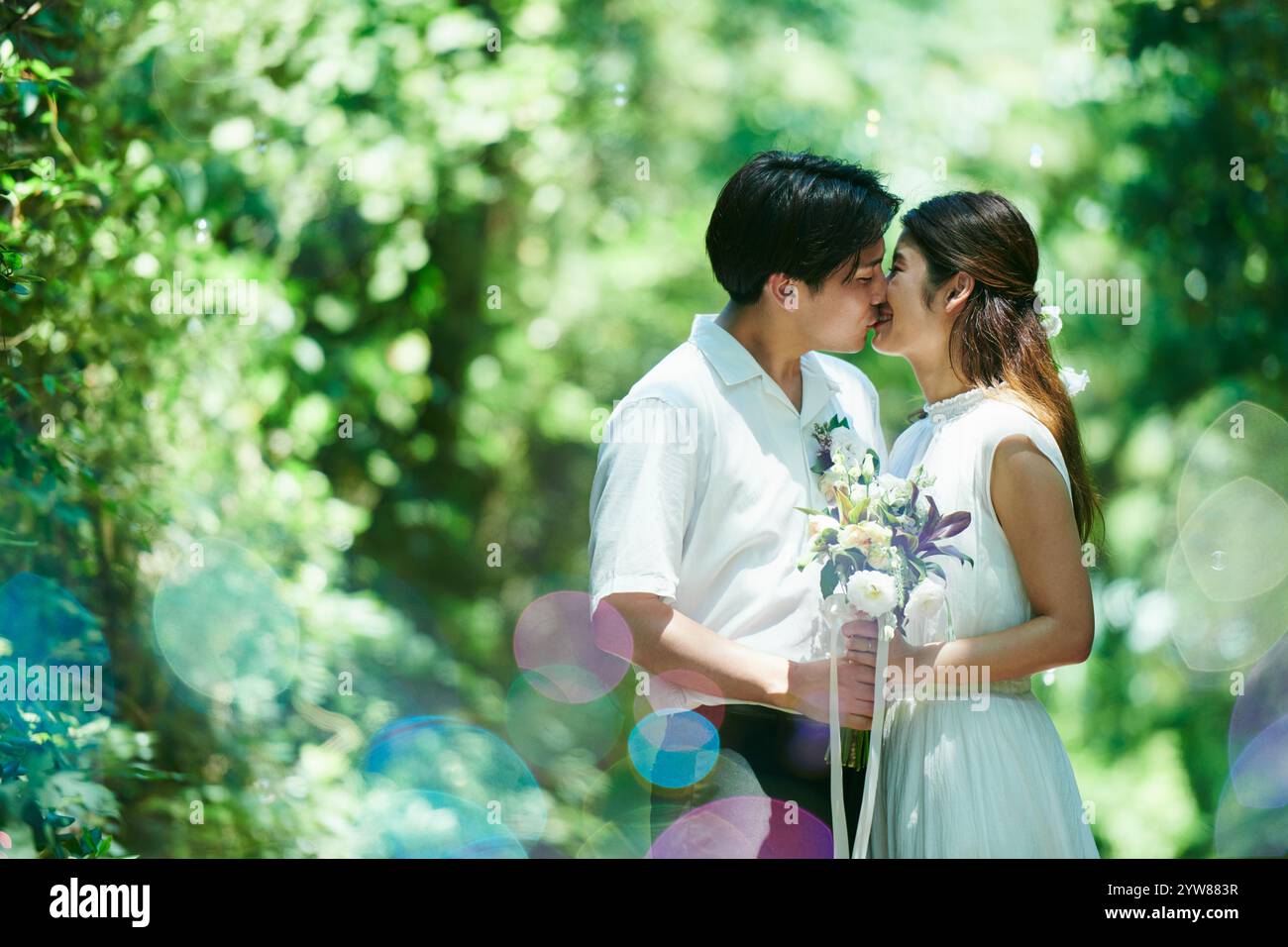 Wedding Couple Kissing Stock Photo - Alamy
