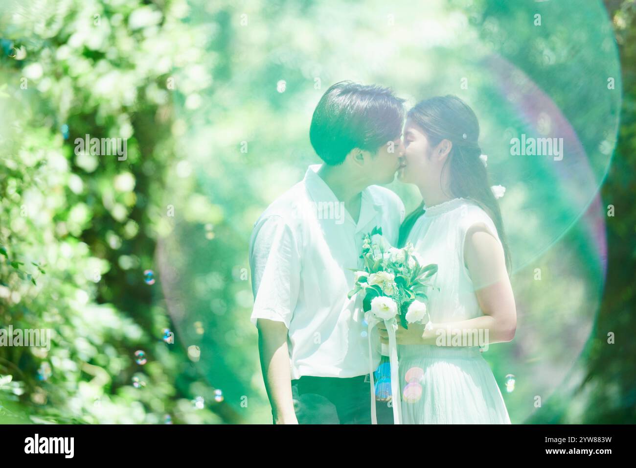 Wedding Couple Kissing Stock Photo - Alamy