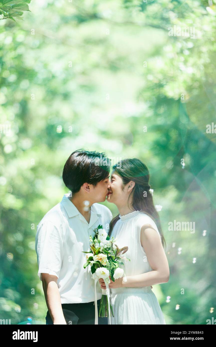 Wedding Couple Kissing Stock Photo - Alamy