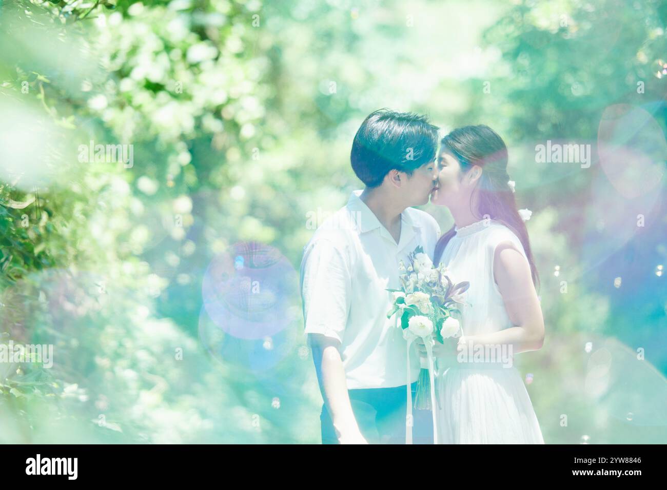 Wedding Couple Kissing Stock Photo - Alamy