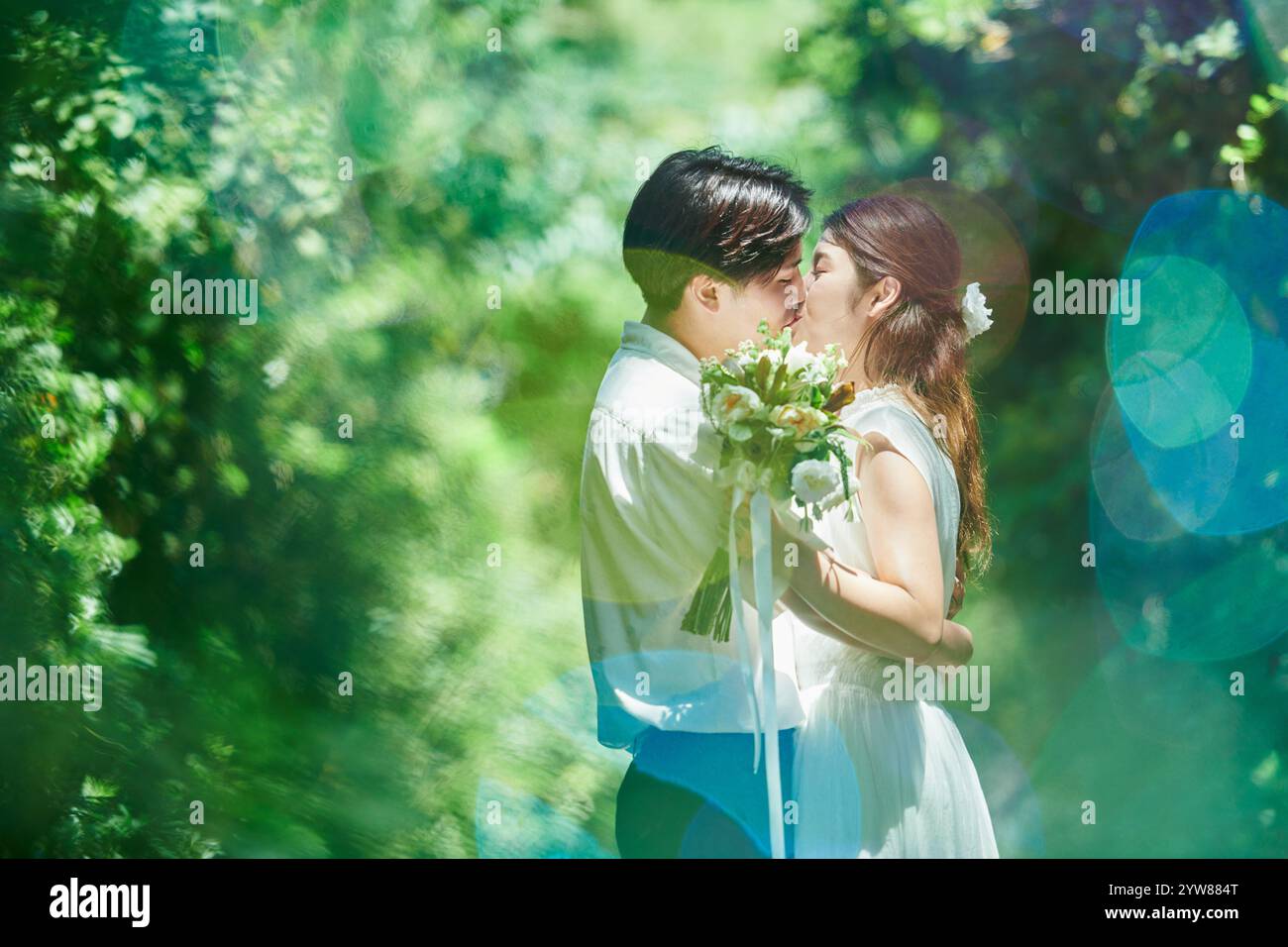 Wedding Couple Kissing Stock Photo - Alamy