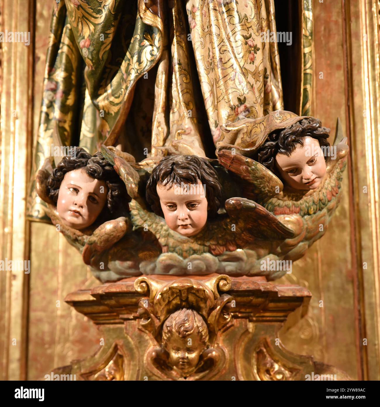 Angel heads at the foot of a statue in Sevilla Cathedral Stock Photo ...