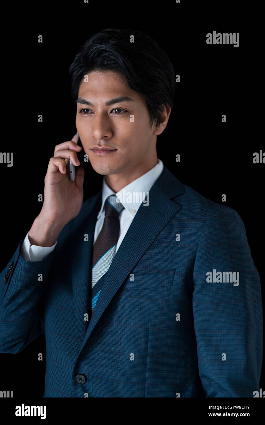 Businessman making a phone call Stock Photo - Alamy
