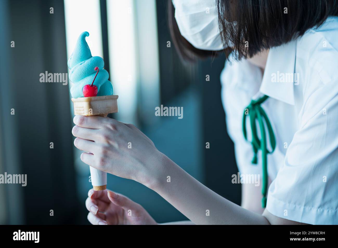 Female student eating soft ice cream Stock Photo - Alamy