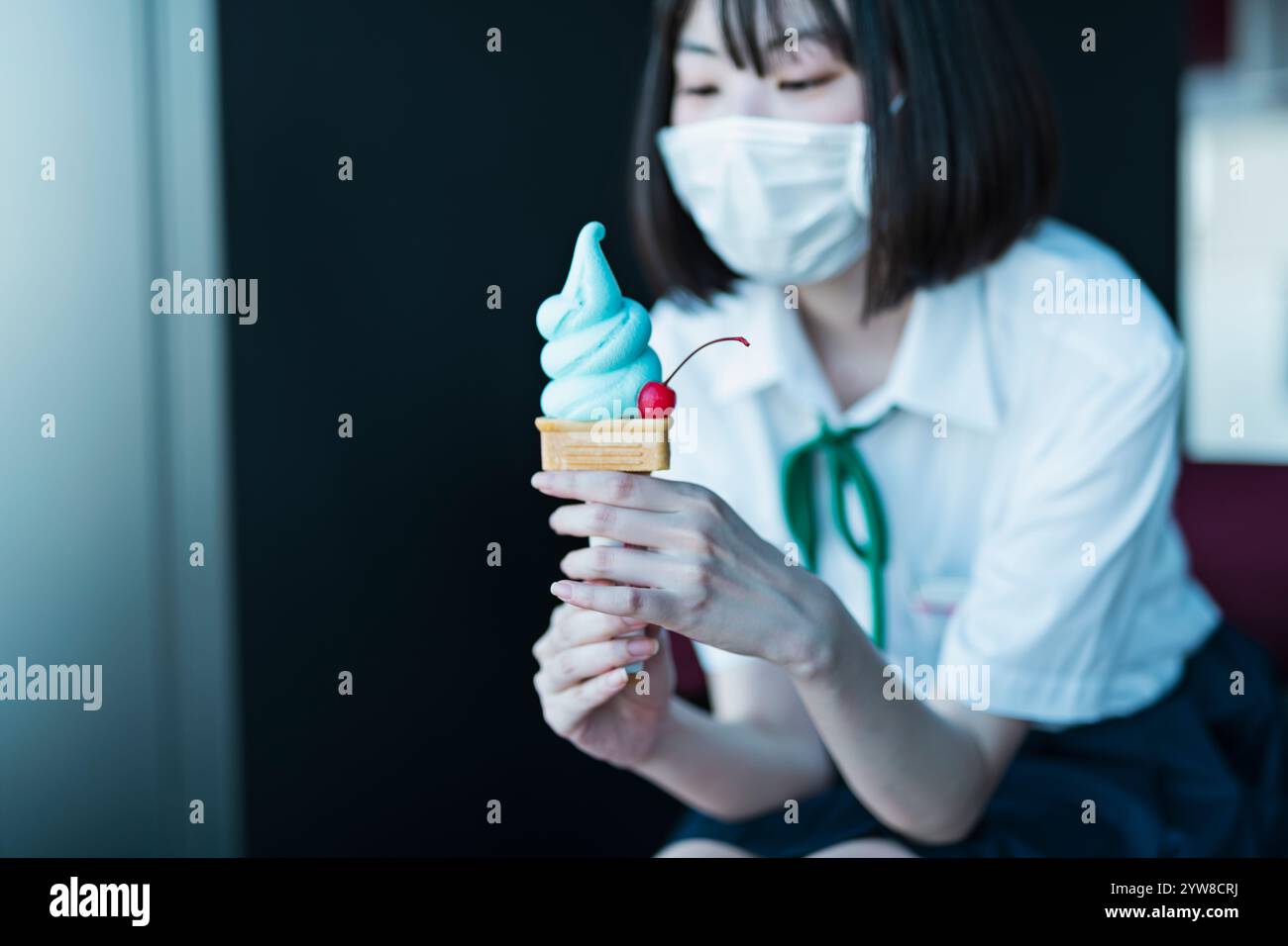 Female student eating soft ice cream Stock Photo - Alamy