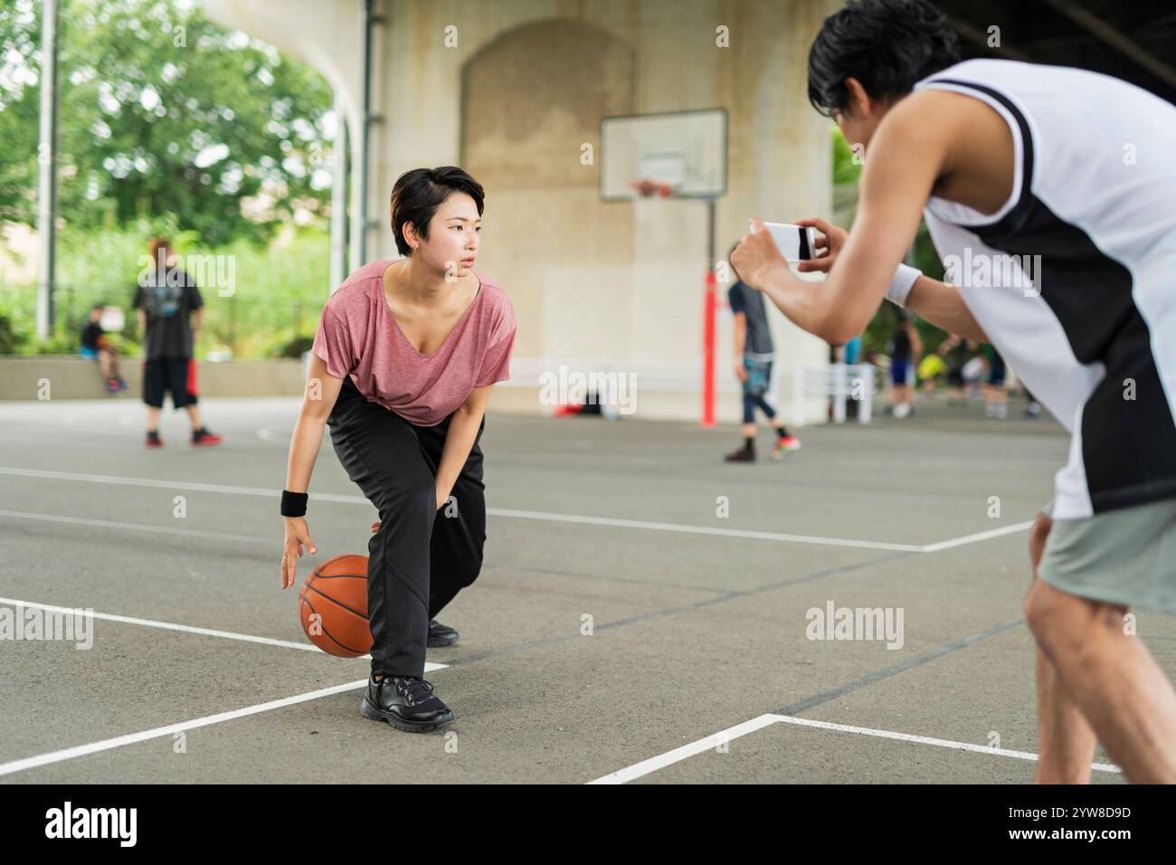 Man recording basketball practice Stock Photo - Alamy