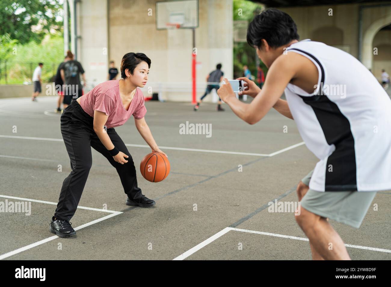 Man recording basketball practice Stock Photo - Alamy
