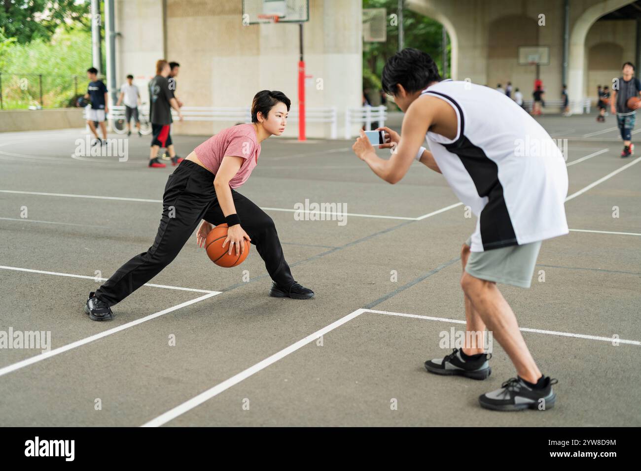 Man recording basketball practice Stock Photo - Alamy
