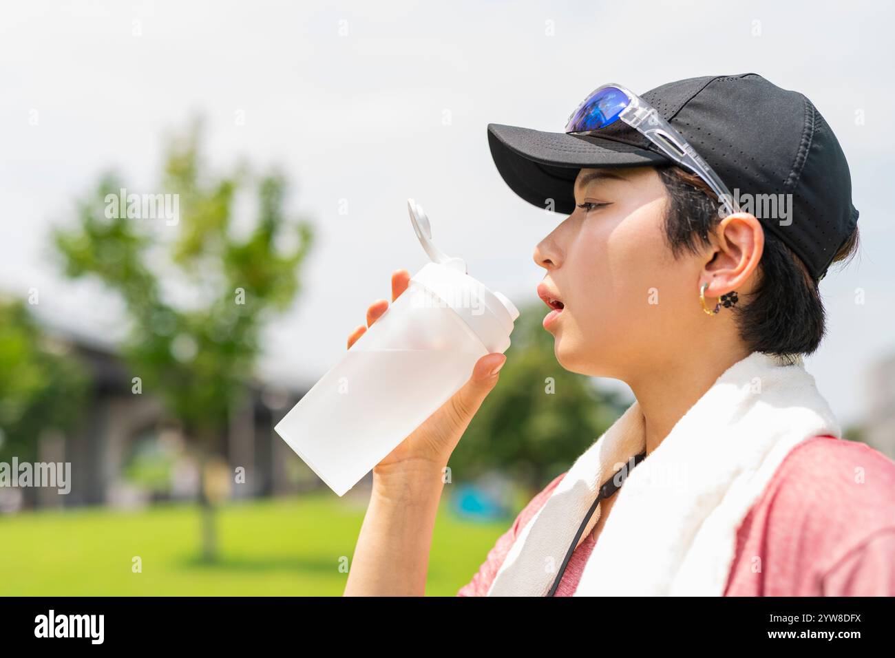Woman taking a break during exercise Stock Photo - Alamy
