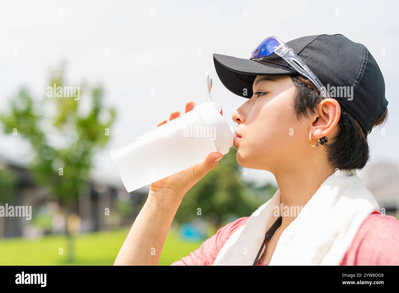 Woman taking a break during exercise Stock Photo - Alamy
