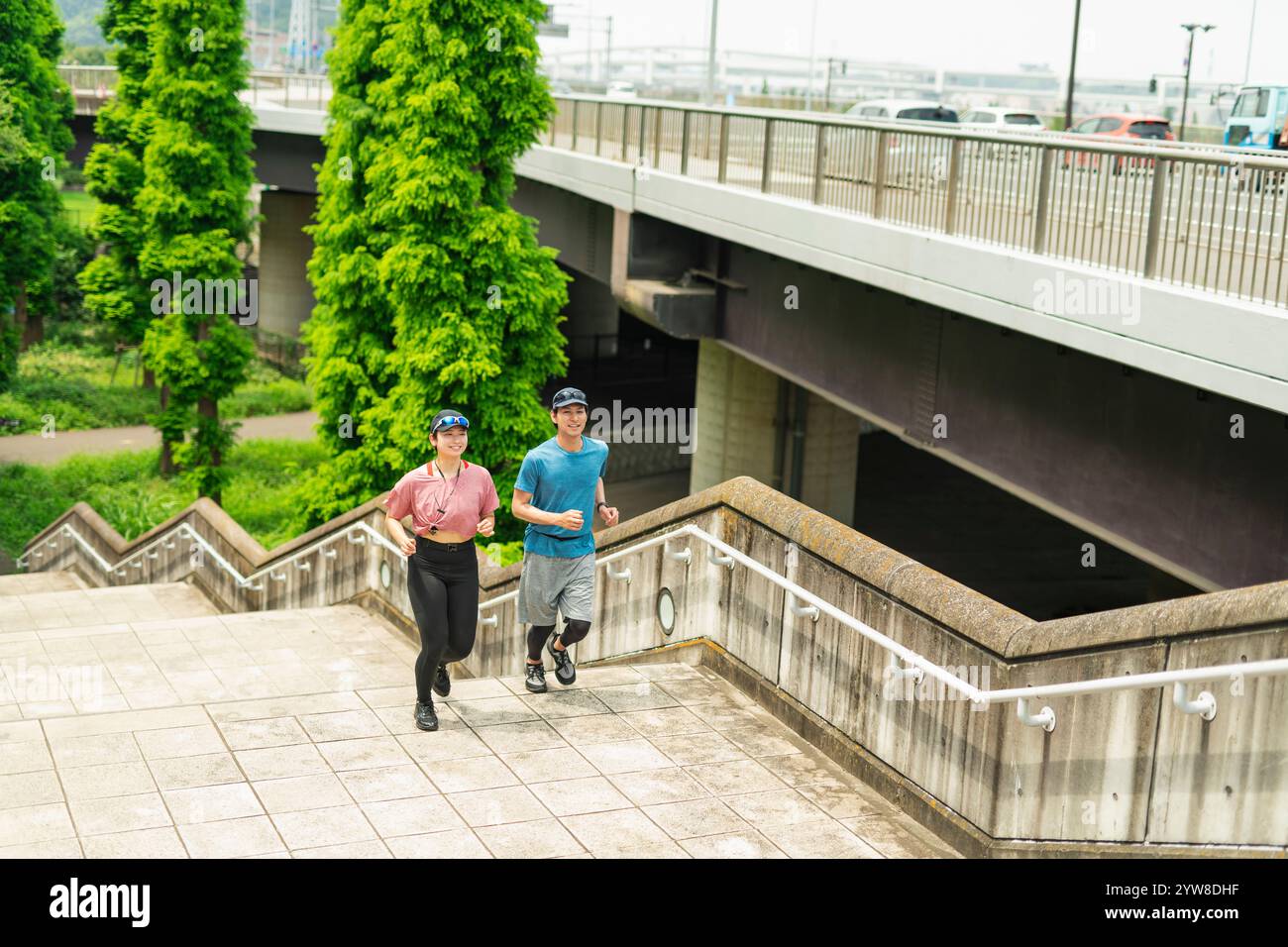Two women running up stairs hi-res stock photography and images - Alamy