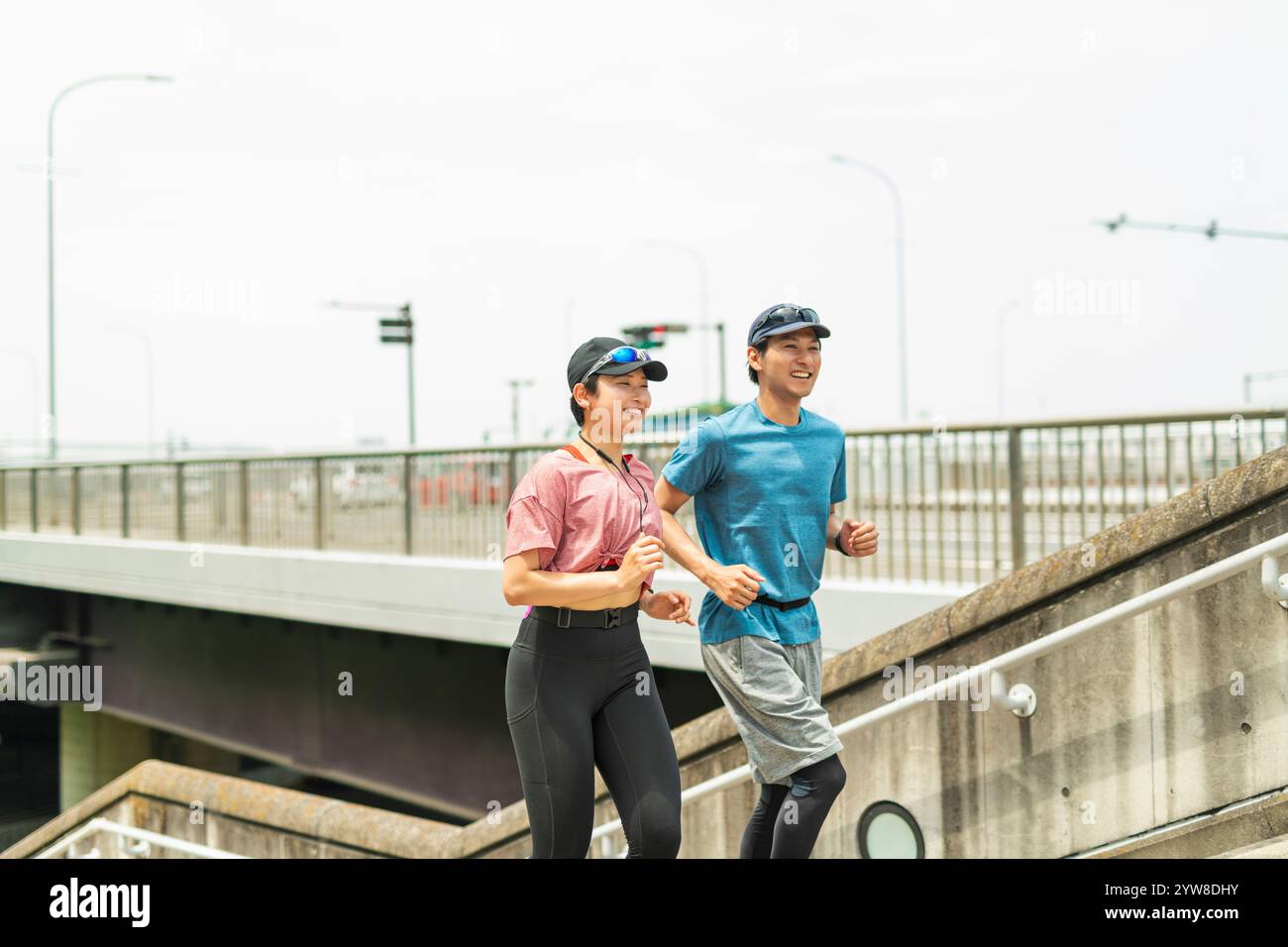 Two women running up stairs hi-res stock photography and images - Alamy