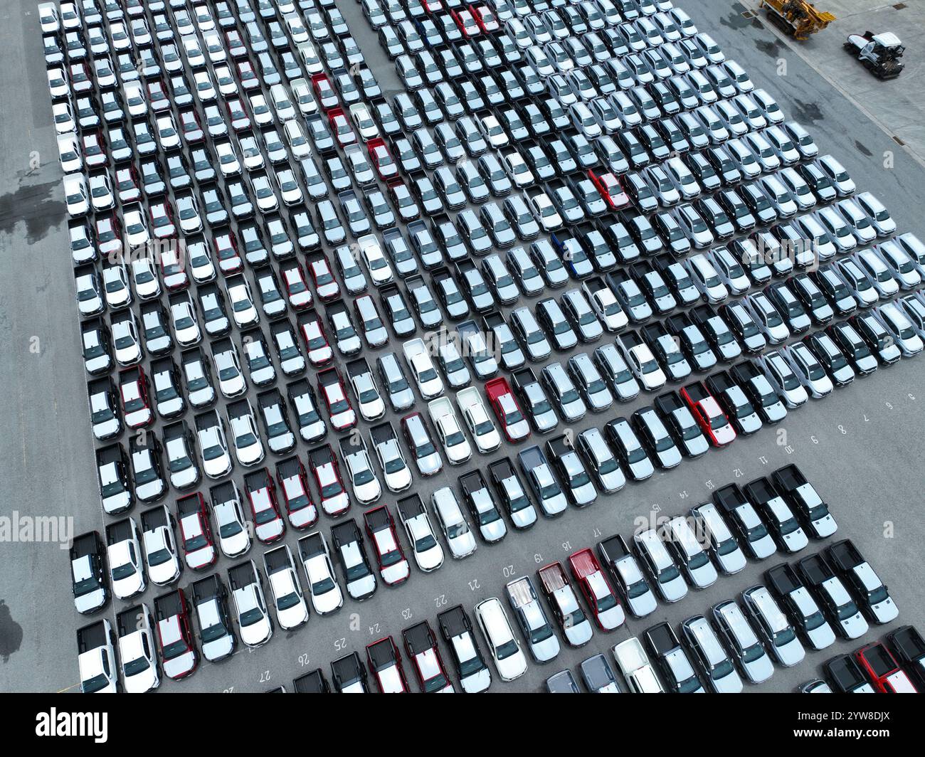 Aerial view of new cars stock at factory parking lot. Above view cars ...