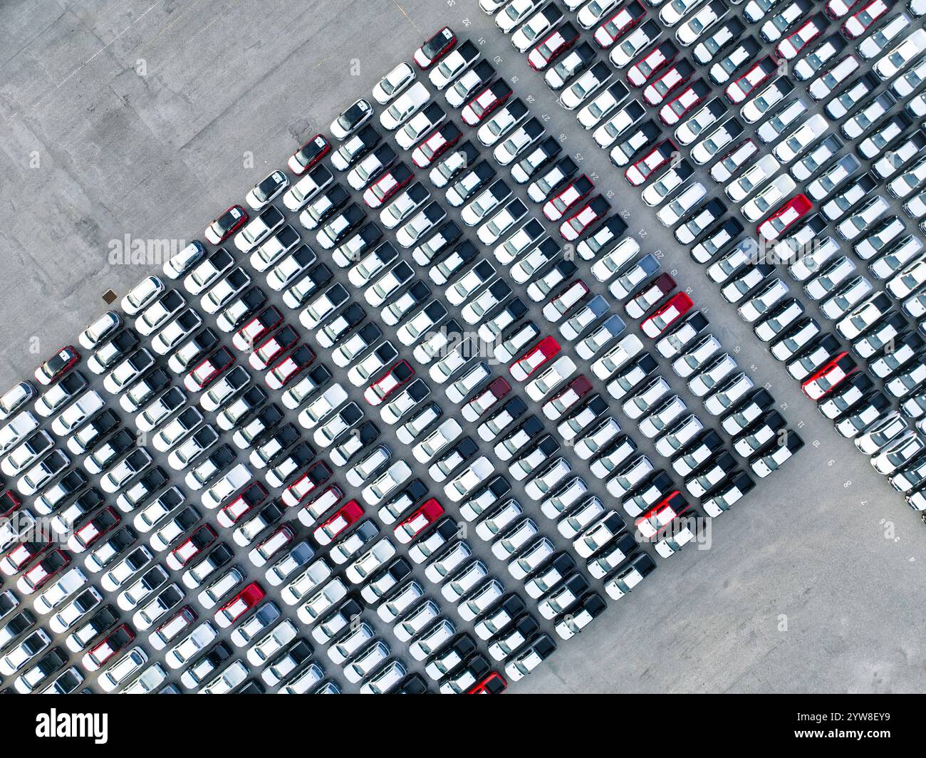 Aerial view of new cars stock at factory parking lot. Above view cars ...