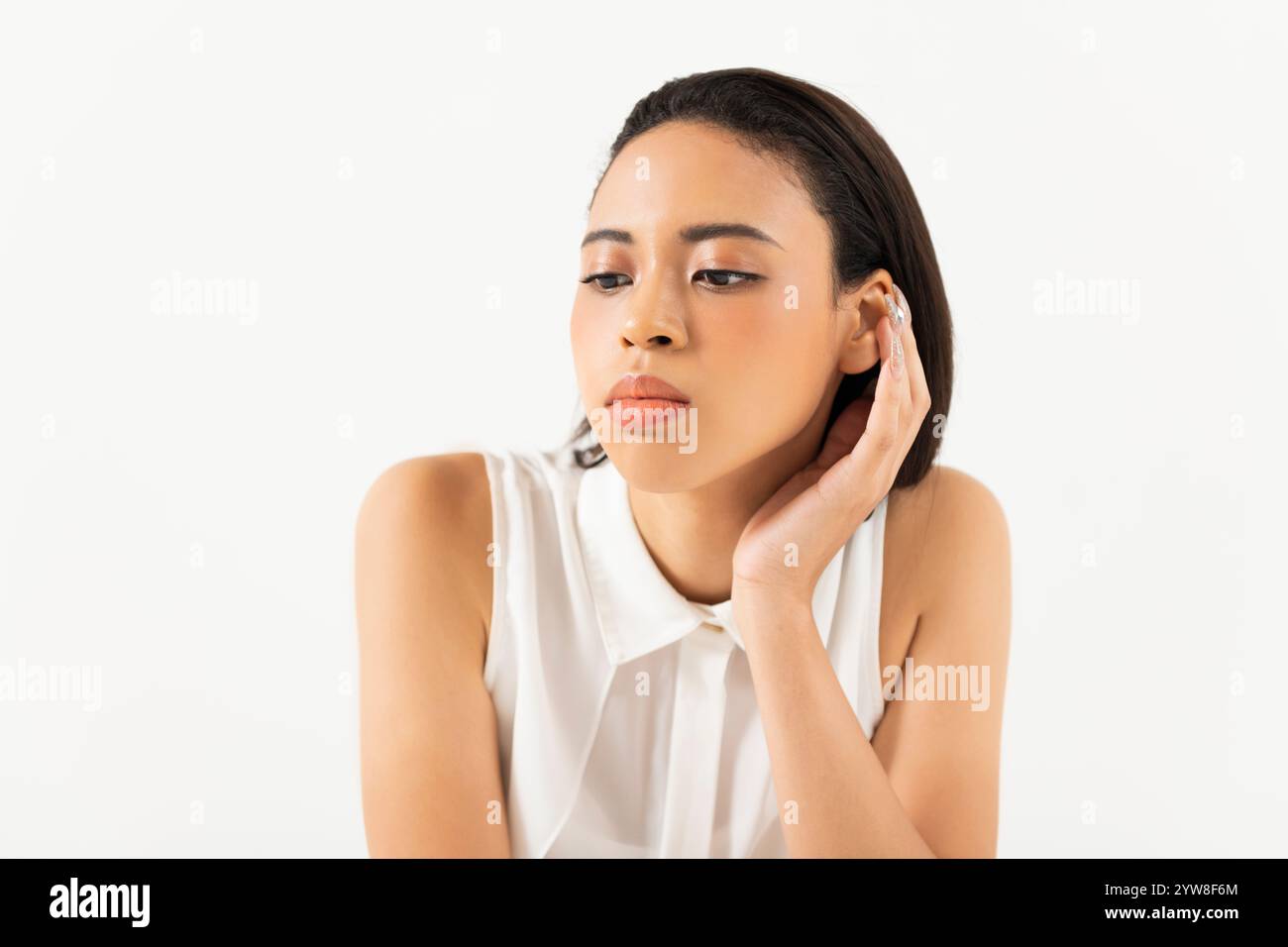 Half-woman with a melancholy look on her face Stock Photo - Alamy