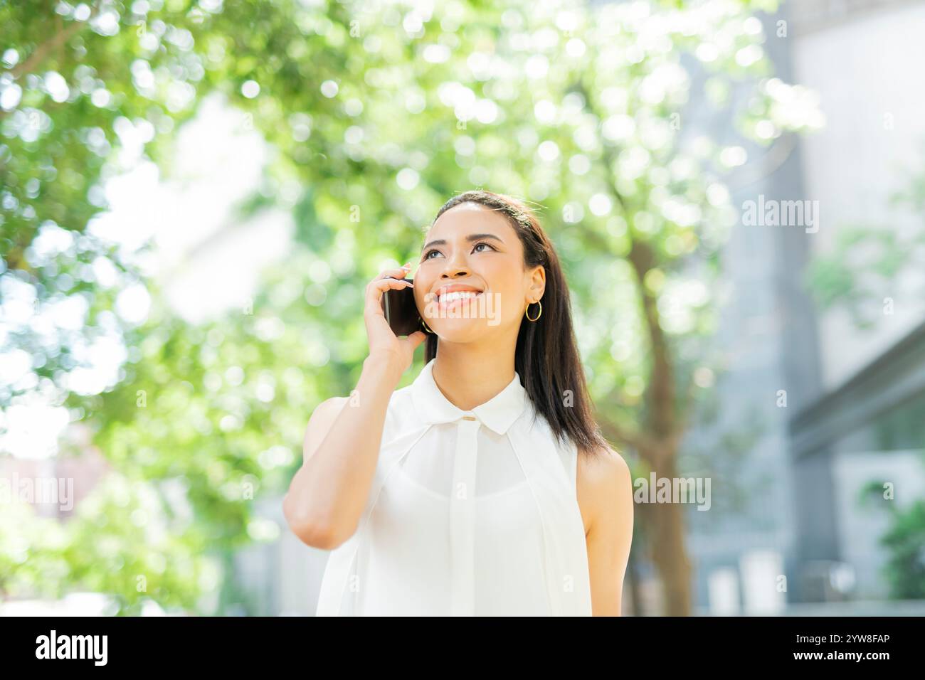 Half-woman making a phone call in the street Stock Photo - Alamy