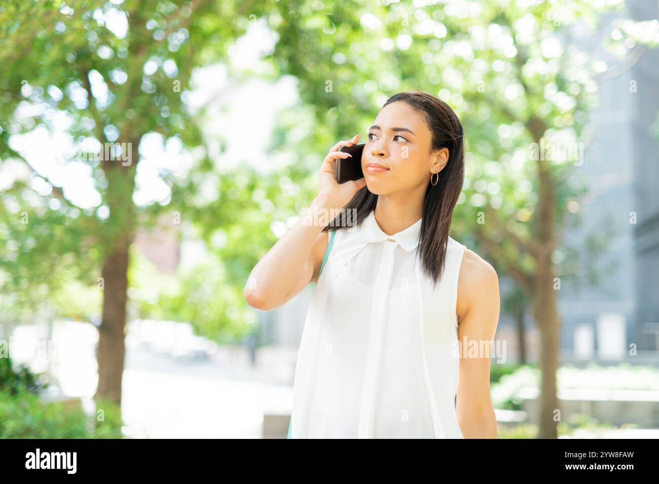 Half-woman making a phone call in the street Stock Photo - Alamy
